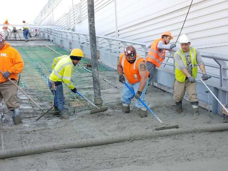 Pouring Concrete Ramp with Roller Screed - Biordi Concrete